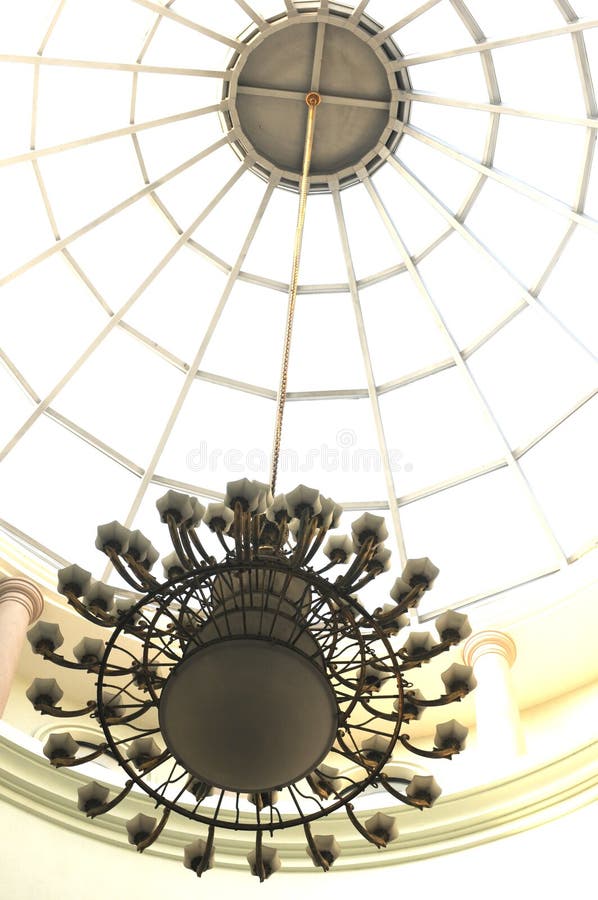 A Round Drop Light with a Golden Chain Hanging on a Glass Dome Stock ...