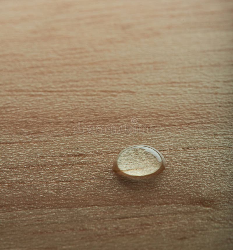 Round drop on wood stock photo. Image of drop, surface - 78526172