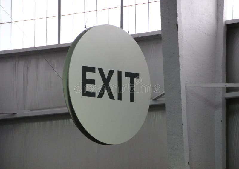 Round Exit Sign in Industrial Settings with Back Light Stock Photo ...