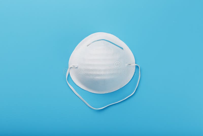 Round Face Mask on a Blue Background. Virus Protection Isolate Stock ...