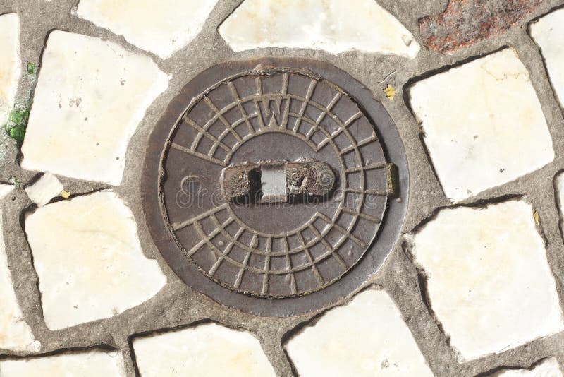 Round fire hydrant lid stock image. Image of brigade - 108889701