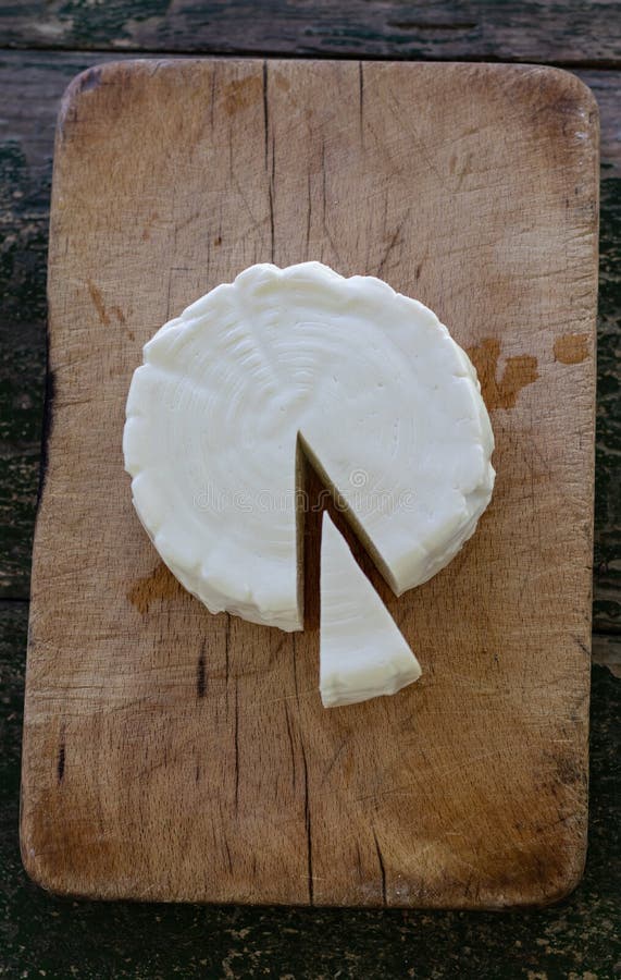 Round Fresh Cheese with a Cut Portion. Top View of a Cheese on a Wooden ...