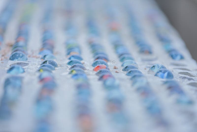 Round glass stones in wall stock photo. Image of inwall - 227316422