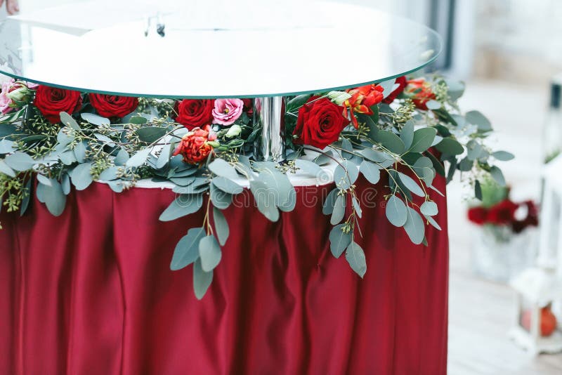 Round Glass Table with Red Cloth Decorated with Greenery Stock Photo ...
