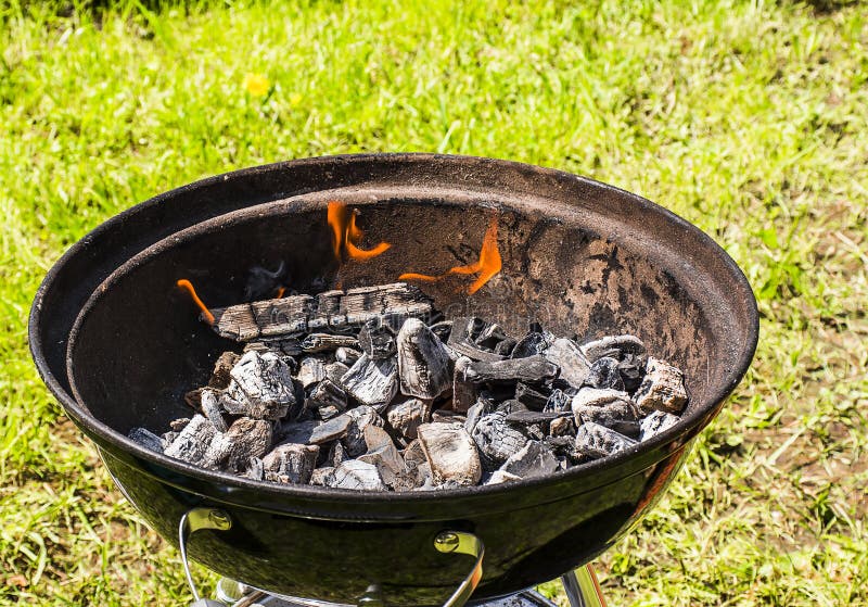 Round Grill with Flat Roasting. Round Grille in the Center with a Fire ...