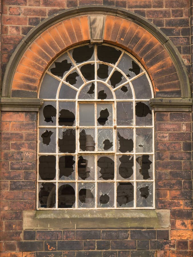 Round-headed Window with Broken Panes Stock Photo - Image of decay ...