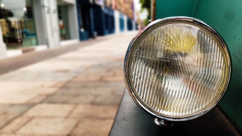 Round Headlight Made of Chrome on a Grey Unique Vehicle. Stock Image ...