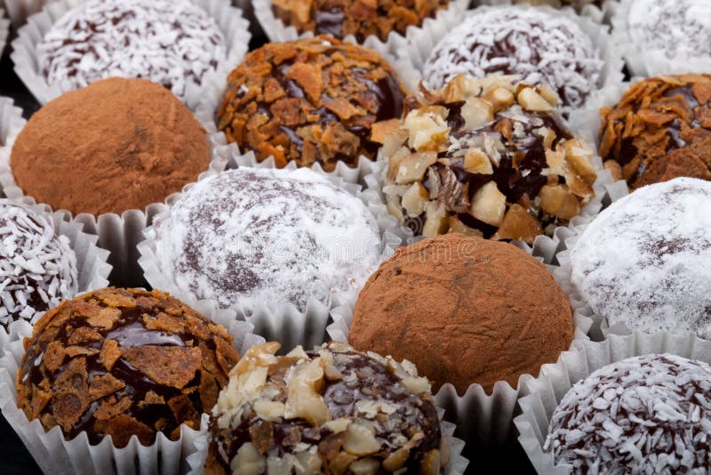 Round Homemade Chocolates in Different Kind of Decor on Paper ...