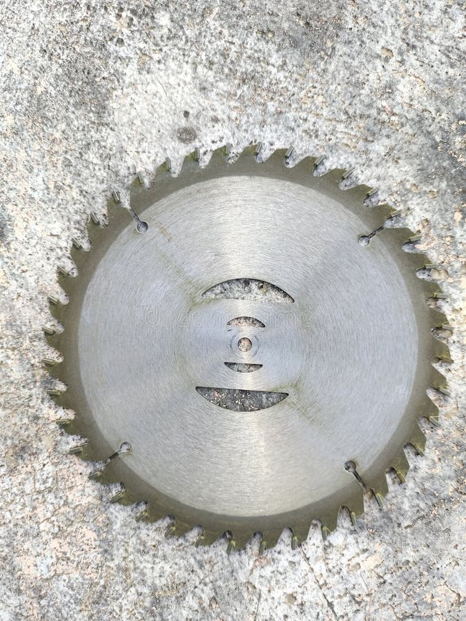 An Round Iron Sharp Blade on the Cement Stock Photo - Image of sharp ...