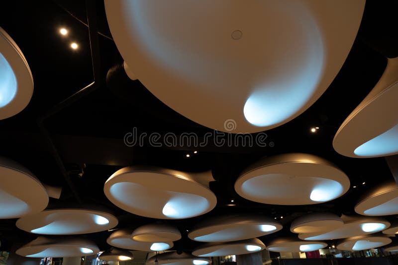 Round Lamp Shades Attached To Ceiling with Soft Light in a Cafe Stock ...