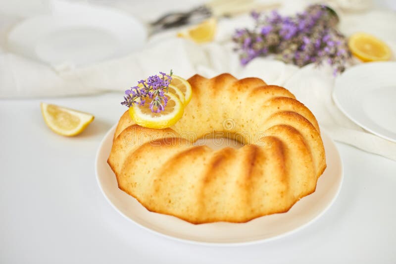 Round Lemon Cake on White Table with Lavender Stock Photo - Image of ...