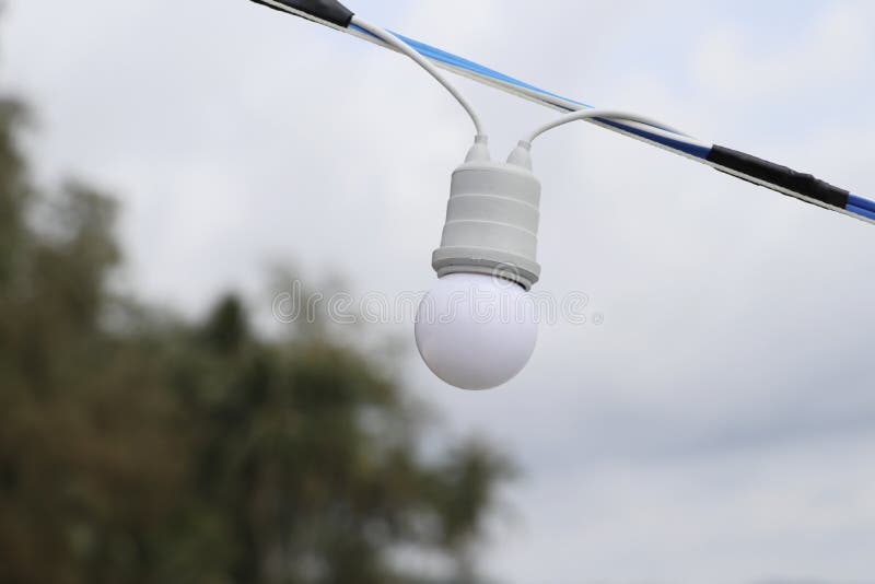 Round Light Bulb with a Sky Backdrop. Stock Image - Image of ...