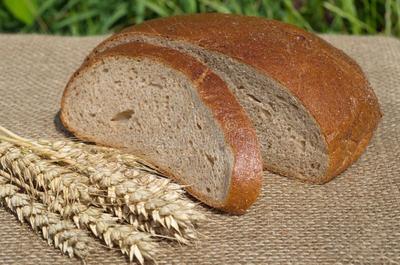 Round Loaf of Rye Bread with a Cut Piece Stock Image - Image of food ...