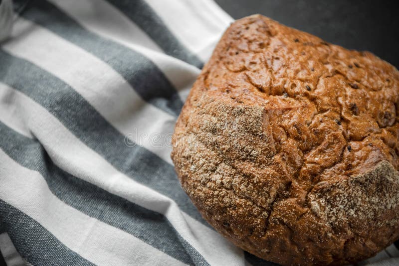 Round Loaf of Rye Bread on a Grey Striped Towel Stock Photo - Image of ...