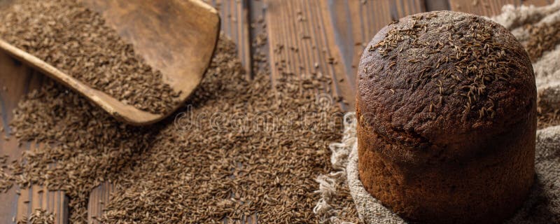 Round Loaf of Rye Bread with Thyme on Rustic Style Wooden Table. Stock ...