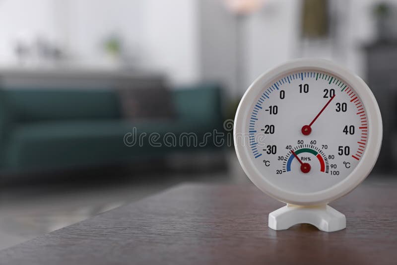 Round Mechanical Hygrometer on Wooden Table in Room. Space for Text ...
