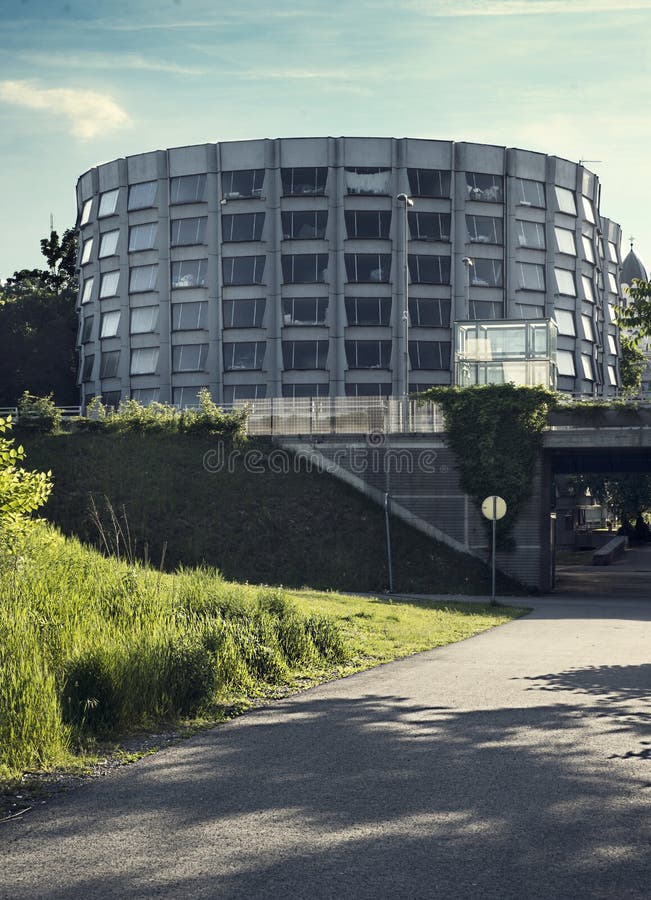 A Round Metal Building with Windows at the Green Grass. Stock Image ...