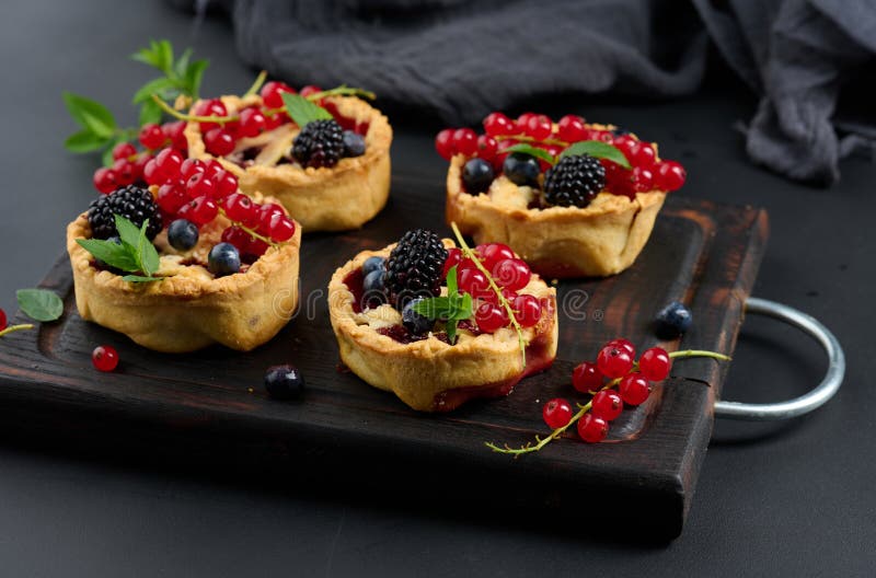 Round Mini Fruit Pie on a Wooden Board Stock Image - Image of brown ...