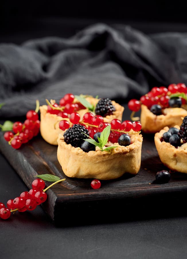 Round Mini Fruit Pie on a Wooden Board, Close Up Stock Photo - Image of ...