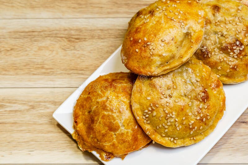 Round Mini Meat Pies on a Plate on a Table. Stock Image - Image of ...
