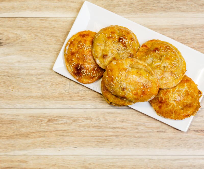 Round Mini Meat Pies on a Plate on a Table. Stock Photo - Image of copy ...