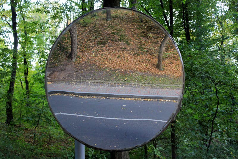 Round Mirror in a Park Reflecting Road and Sidewalk Stock Photo - Image ...