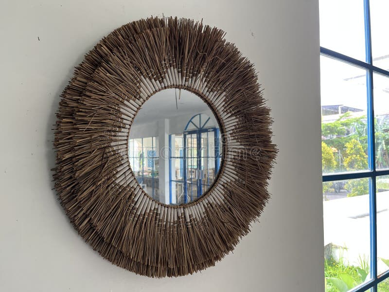 Round Mirror with Rattan Frame on the Wall Stock Image - Image of ...