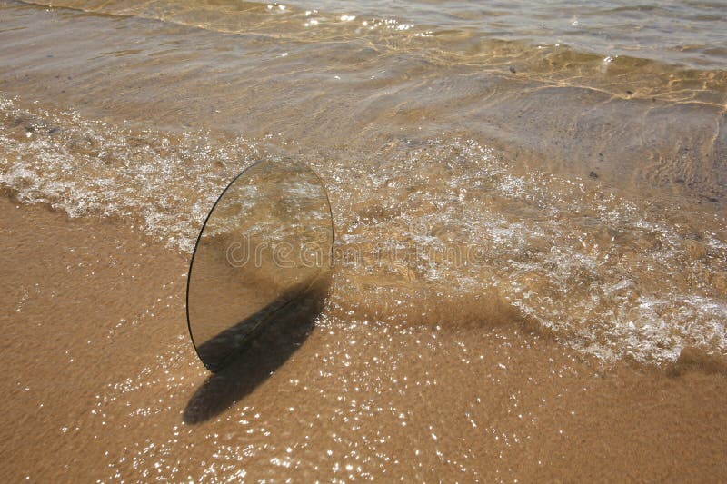 Round Mirror Reflecting Sea on Sandy Beach, Space for Text Stock Image ...