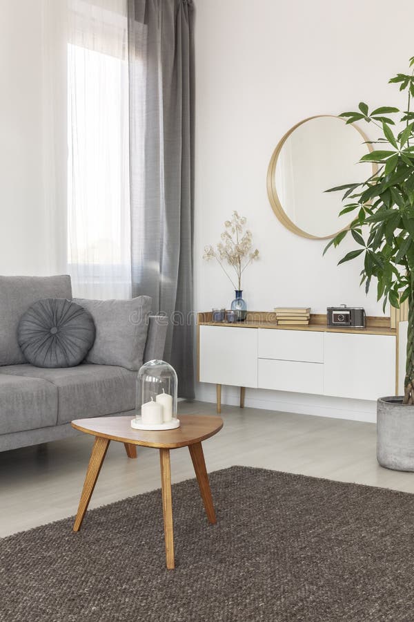 Round Mirror in Wooden Frame on Empty White Wall of Bright Living Room ...