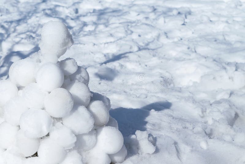 The Round Mound of Snowballs Lying on the White Snow. Stock Photo ...