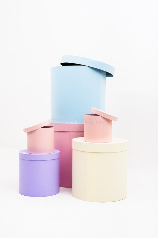 Round Multi-colored Gift Boxes of Different Sizes on a White Background ...