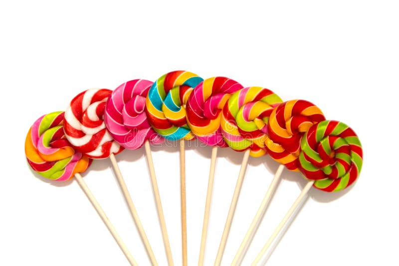 Round Multi-colored Lollipops on a Blue Background Stock Photo - Image ...