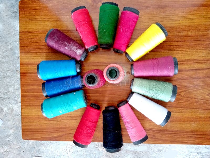 Round Multi Colored Sewing Nylon Thread on Table Stock Photo - Image of ...