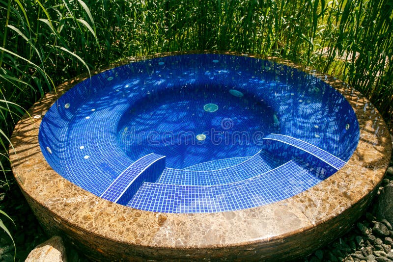 Round Outdoor Jacuzzi among Tall Thickets and Grass Stock Image - Image ...