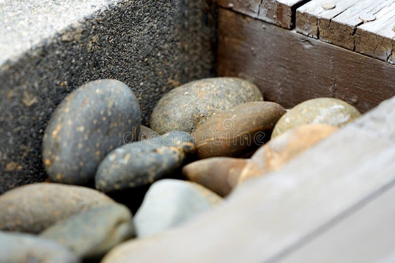 Round and Oval Shape Stones with Concrete Wall Stock Image - Image of ...