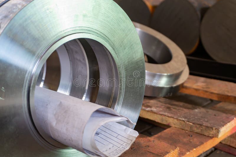 Round Parts with Drawings after Turning are on a Wooden Rack in the ...