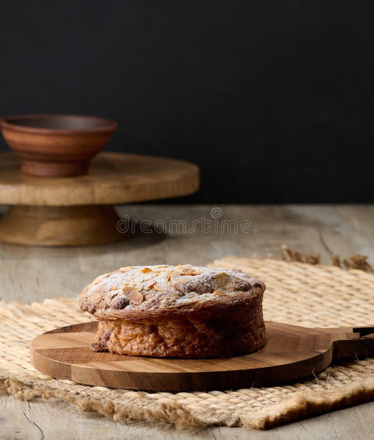 Round Pastry with Almonds and Butter Sprinkled with Powdered Sugar on ...