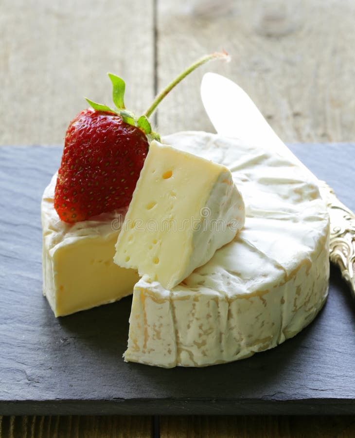 Round Piece of Soft Cheese with a White Mold Stock Photo - Image of ...