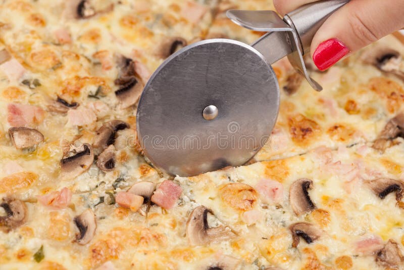 Round Pizza Cutter in a Female Hand Stock Photo - Image of cutting ...