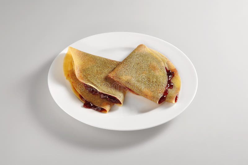 A Plate with Crepes and the Ingredients for the Recipe Shown Above ...