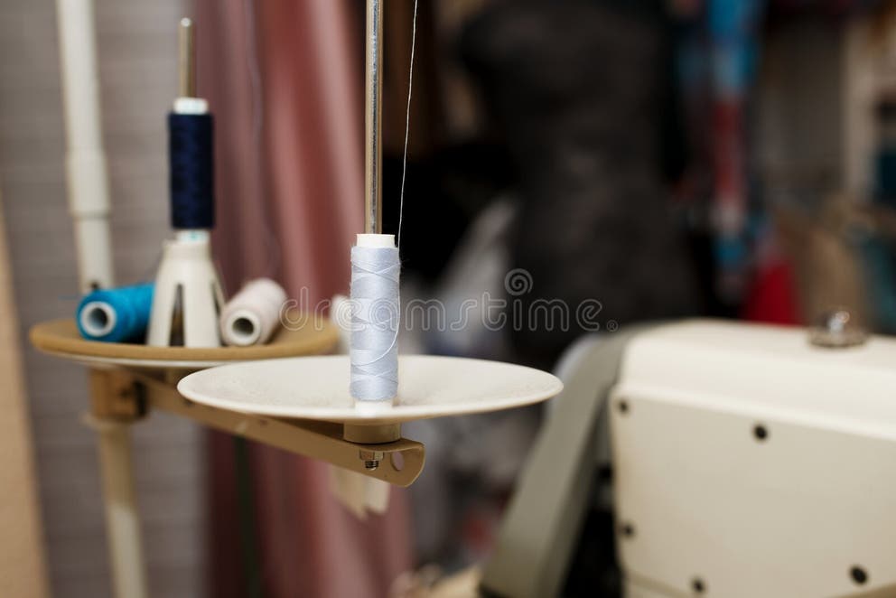 Round Plates of Sewing Machine with Spools of Threadsloaded into ...