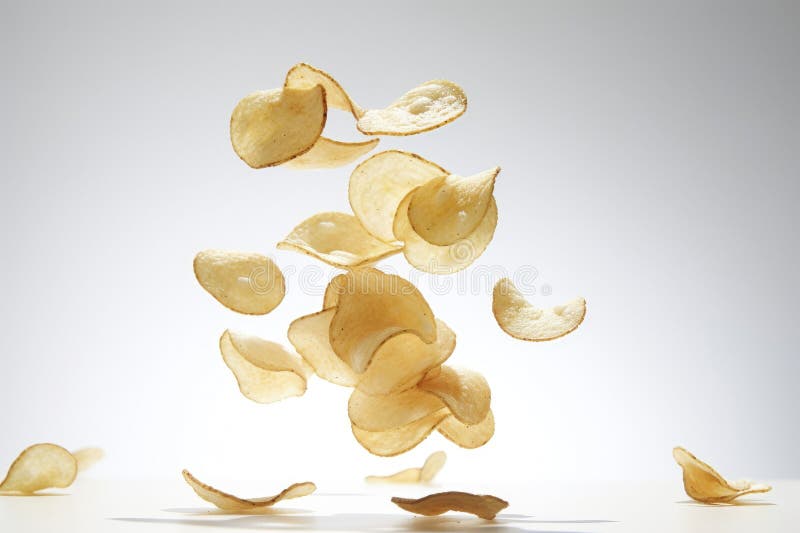 Round Potato Chips with Spices Fall in Pile on Light Gray Gradient ...