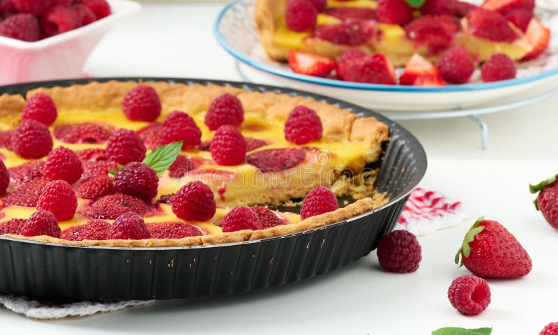 Round Quiche with Red Strawberries and Raspberries on a White Table ...