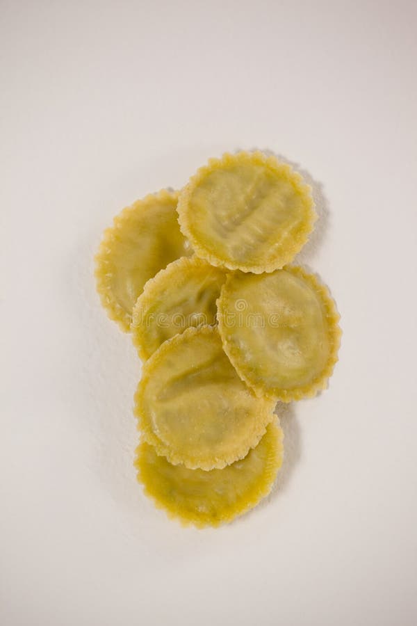 Round Ravioli Topped with Tomato Sauce Sprouts and Black Olive Stock ...