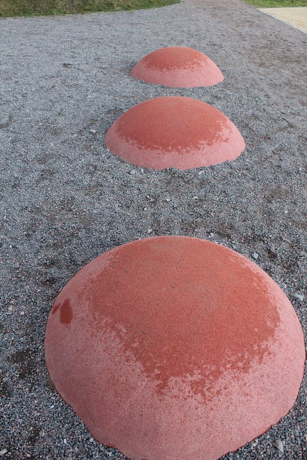Round Red Concrete Stoppers on the Landing Stock Image - Image of ...