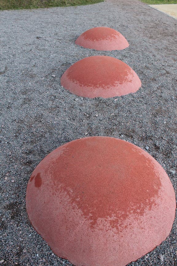 Round Red Concrete Stoppers on the Landing Stock Image - Image of ...