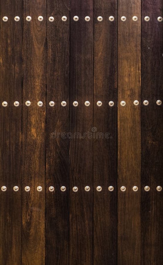 Rivets on wood gate stock image. Image of decoration - 82360881