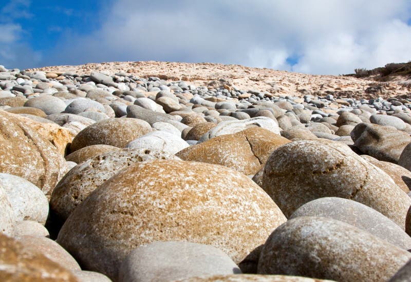 Round rocks on the beach stock image. Image of pebble - 14756771