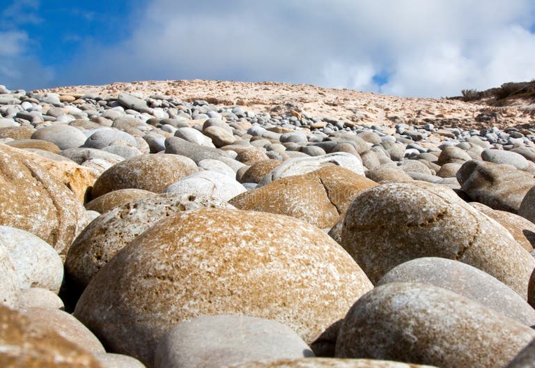 Round rocks on the beach stock image. Image of pebble - 14756771