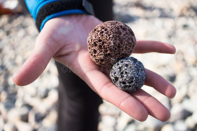 Round rocks in hand stock image. Image of white, healthy - 115624835